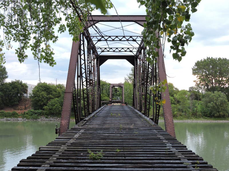 Old Train Bridge Over a Slow Moving River Stock Photo - Image of train ...