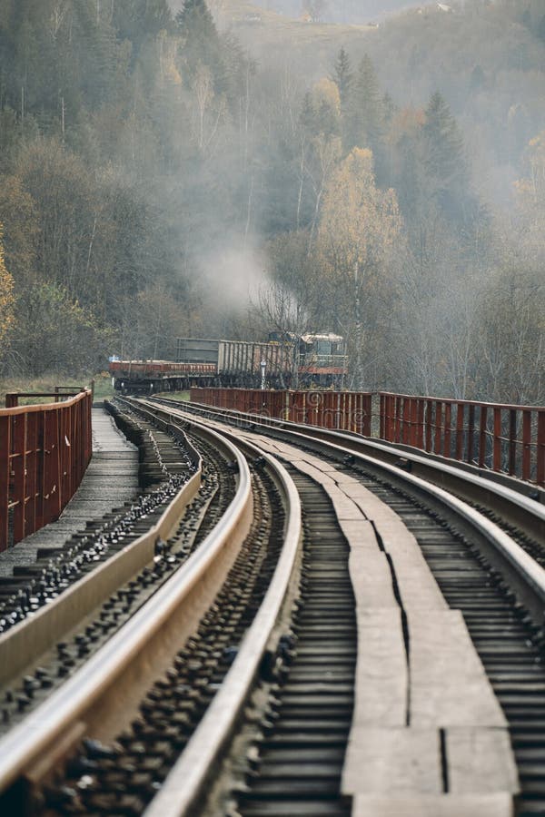 An Old Train is Going Along the Track Stock Image - Image of smoke ...