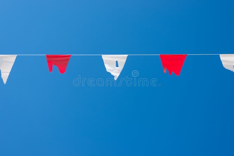 Old Triangle Flags Hung Across the Blue Sky. Stock Photo - Image of ...