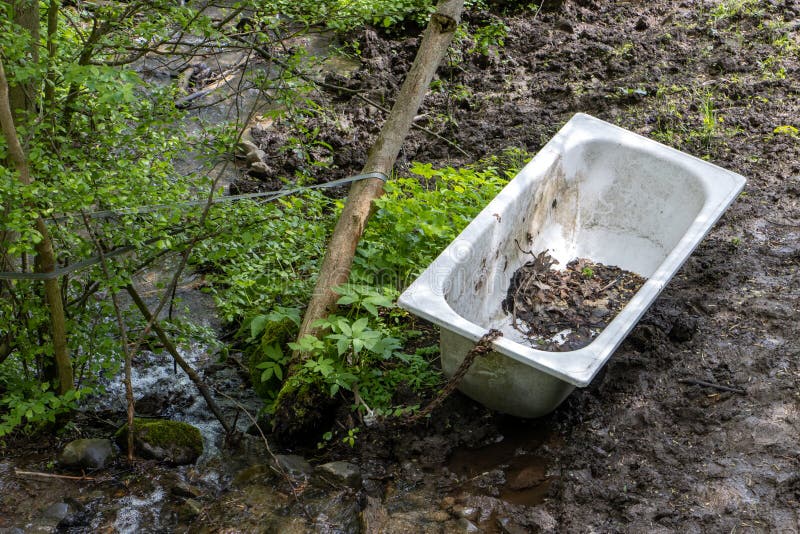 An Old Tub Chained To a Tree by a Stream. Stock Image - Image of nature ...