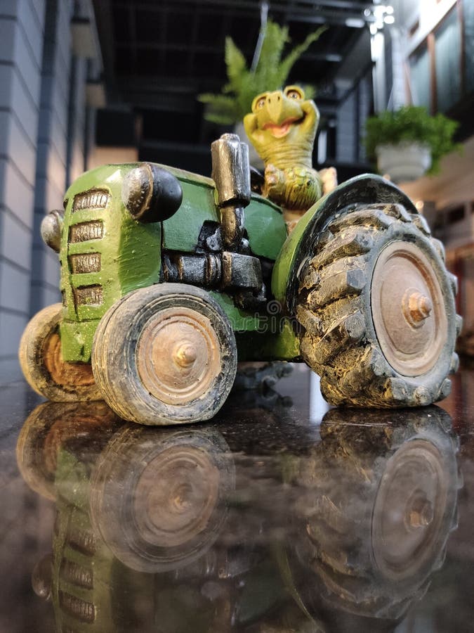 Old turtle drive a tractor editorial photography. Image of machine ...