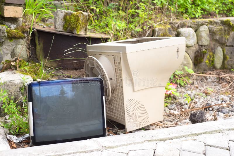 Old Tv and Computer Monitor Thrown in the Grass Stock Image - Image of ...