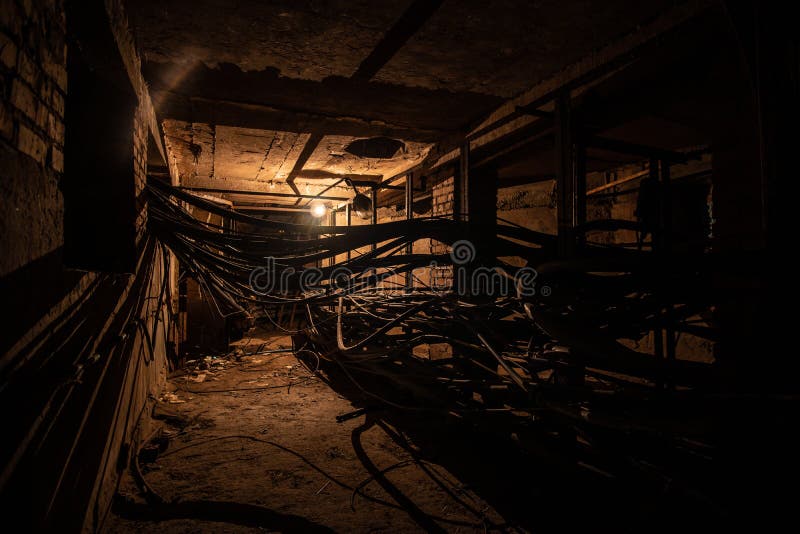 An Old Underground Brickwork Cable Tunnel or Basement with Cables Stock ...
