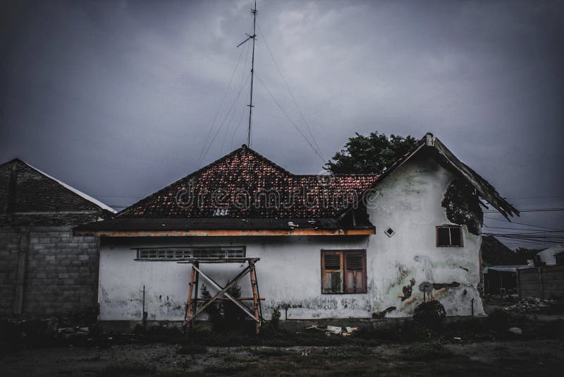An Old Uninhabited House that Has a Lot of Damage Stock Photo - Image ...