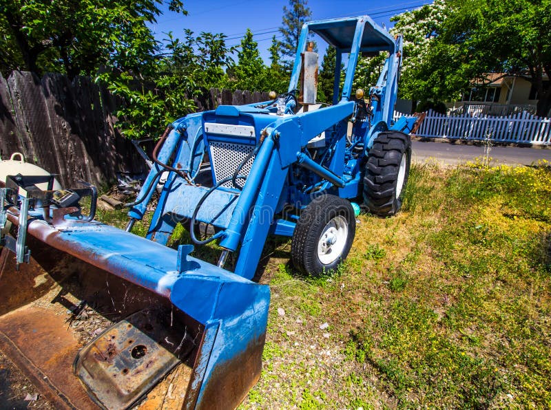 Old Blue Tractor with Front Scoop & Backhoe Stock Image - Image of blue ...