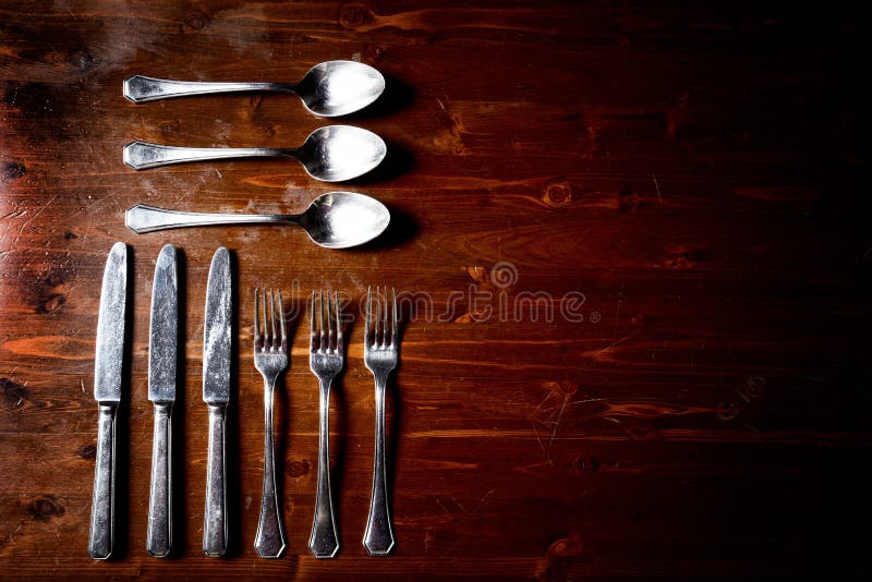 Old Used Cutlery on Dark Wooden Table Stock Photo - Image of scratches ...