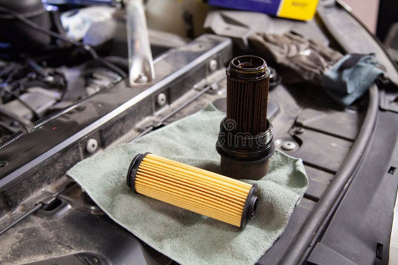 Old Used Oil Filter and a New One Stock Photo - Image of automobile ...