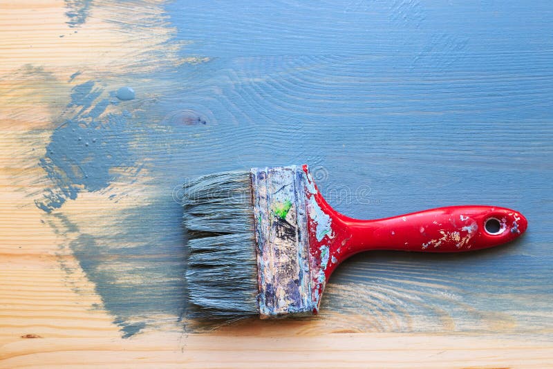 Old Used Paint Brush on Partial Paint Wood Background. Horizontal ...