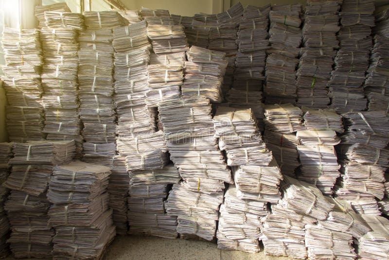 Old Used Papers Were Packed Together in a Room. and a Light Shines Down ...