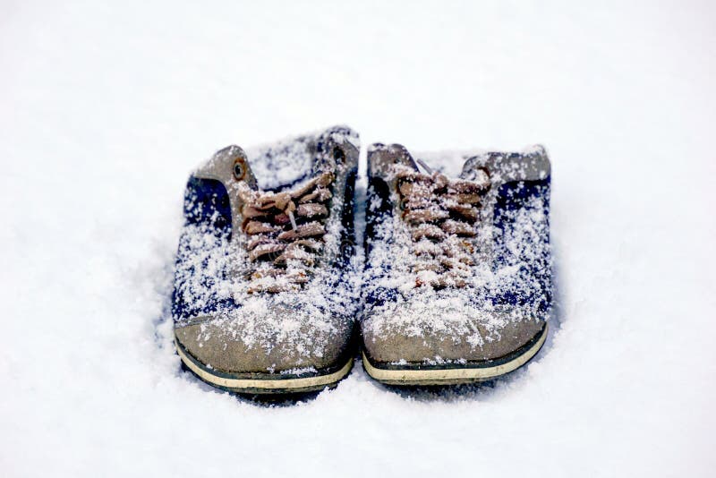 Old Used Shoes in the Snow. Winter Theme . Stock Image - Image of boots ...