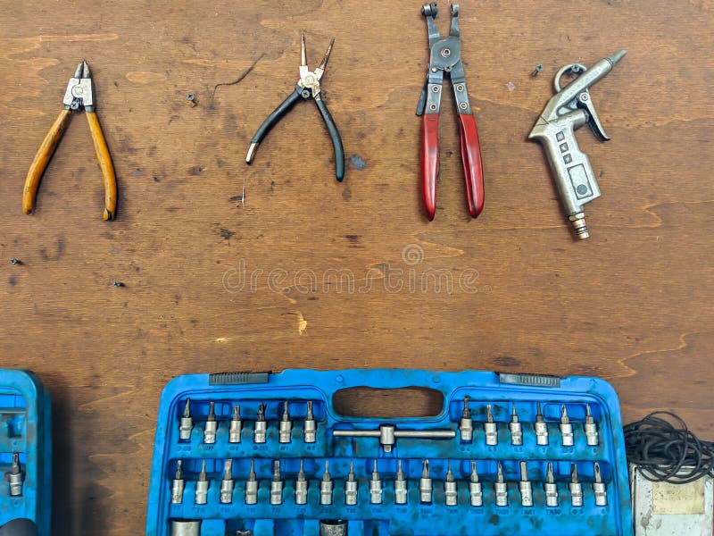 Old and Used Tools for Fixing and Repairing Hanging in a Garage with ...