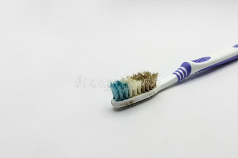 An Old Used Toothbrush on a Clean Background. Space for Text. Stock ...