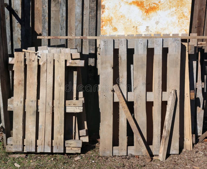 Old Used Wooden Pallets Near a Rustic Barn Stock Image - Image of ...
