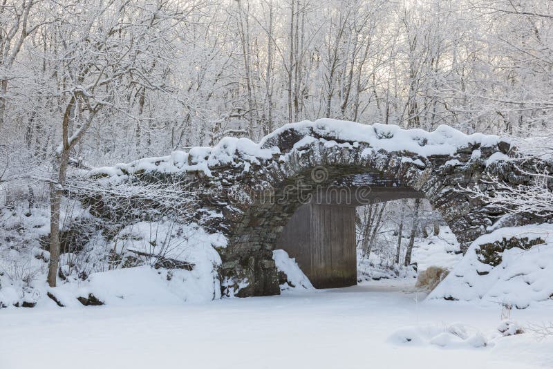 Old Vault Bridge with Snow Over a Frozen River Stock Photo - Image of ...