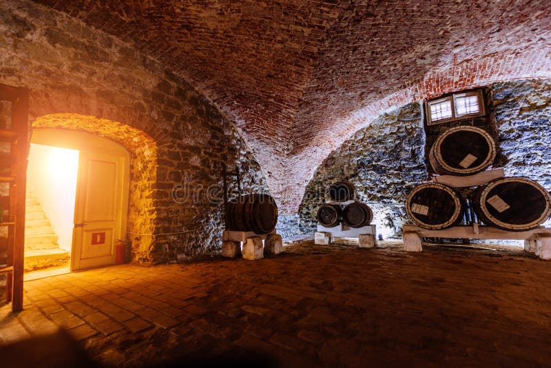 Old Red Brick Vaulted Wine Cellar with Barrels Stock Photo - Image of ...
