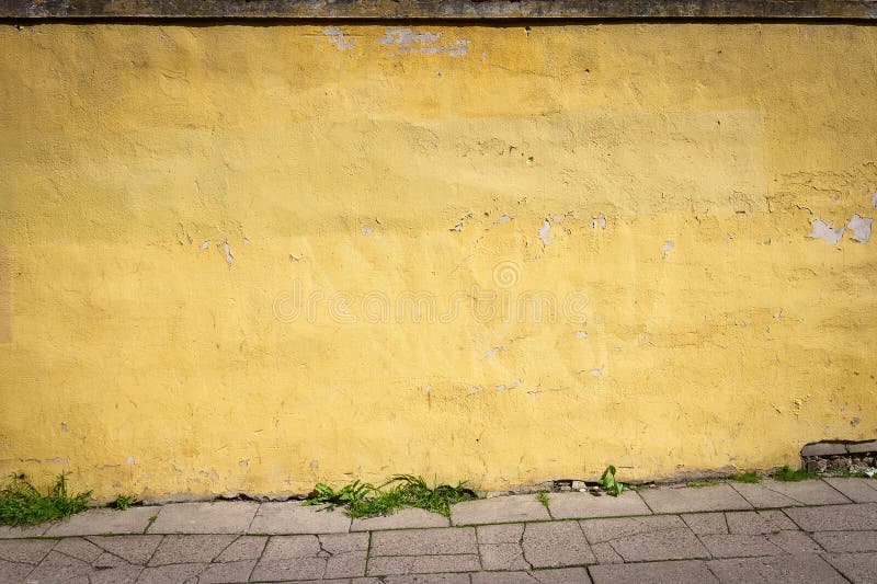 Old vibrant yellow wall stock photo. Image of stone - 313788720