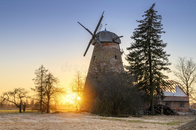 Old Vintage Abandoned Windmills in Sunset Stock Image - Image of ...