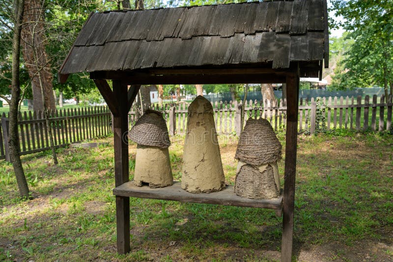 Old Vintage Beehive in the Garden Stock Photo - Image of grass ...