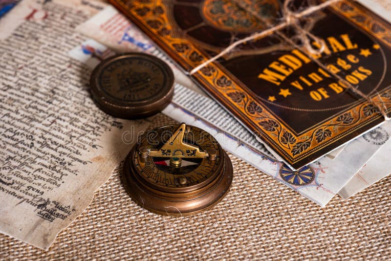 Old Vintage Brass Compass with Sundial Lying on a Very Old Medival Hand ...