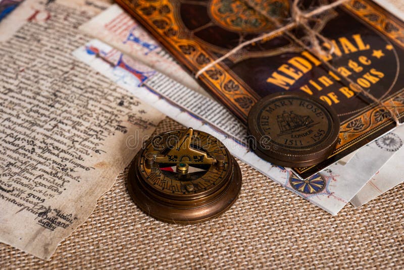 Old Vintage Brass Compass with Sundial Lying on a Very Old Medival Hand ...