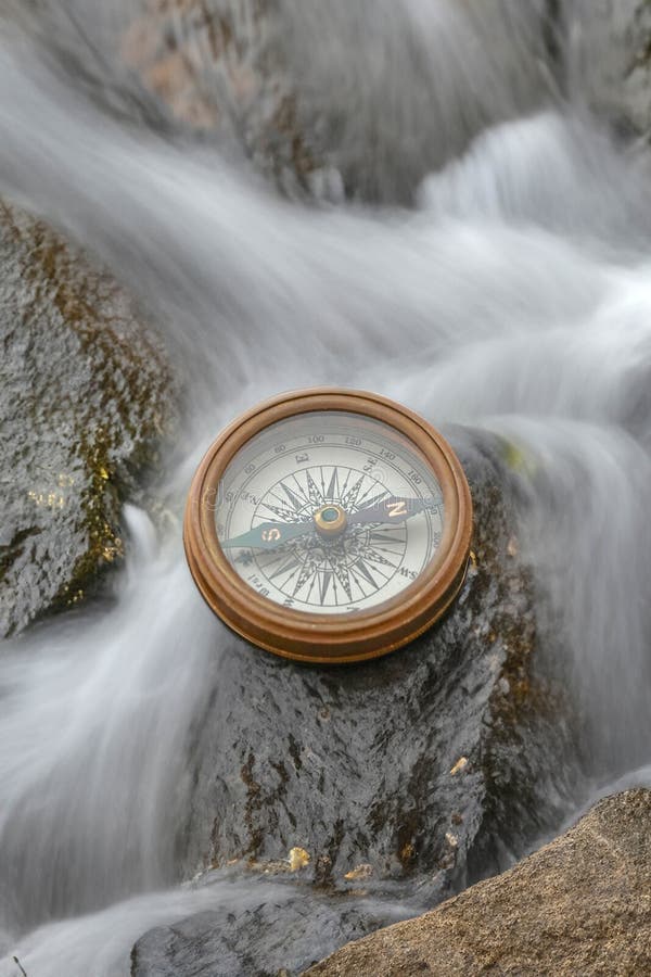 Old Vintage Brass Navigation in a Stream of Water and on a Rock Stock ...