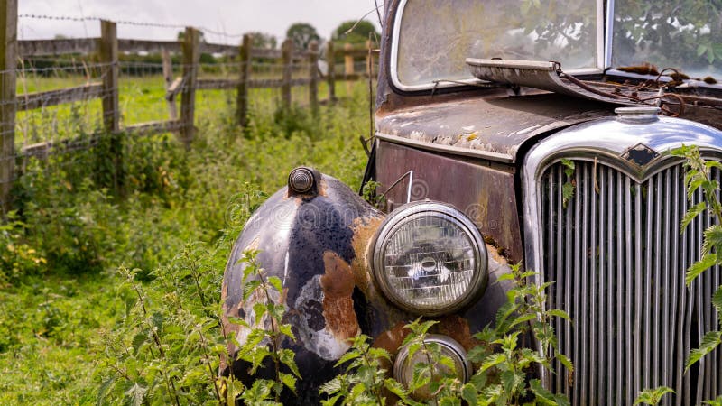 An Old Vintage Car Rusting in a Field Stock Photo - Image of abandoned ...