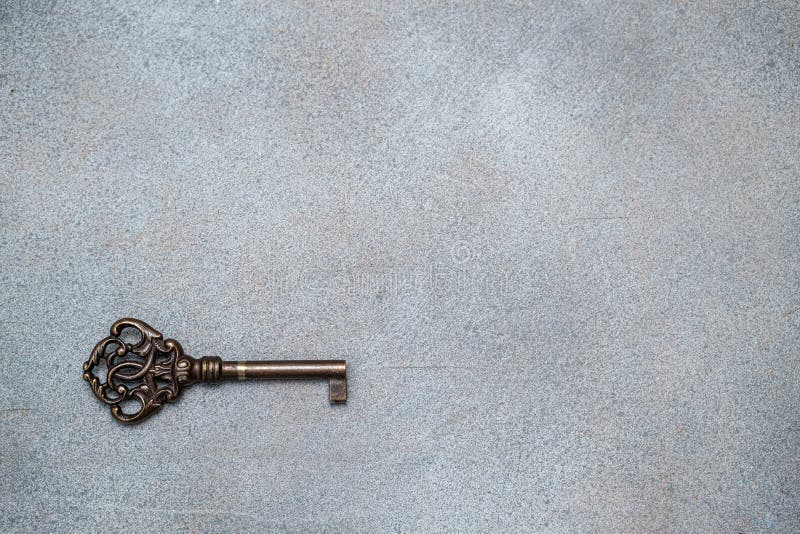 Old Vintage Key on an Abstract Gray Background. View from Above Stock ...
