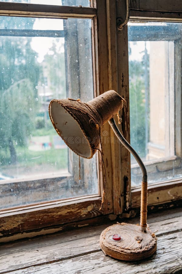 Old Vintage Reading Lamp Coiled with a String on Old Window Sill Stock ...