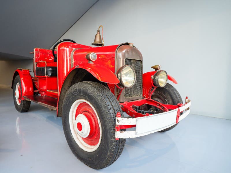 Old, Vintage Red Fire Truck with Big Wheels Inside a Building Stock ...