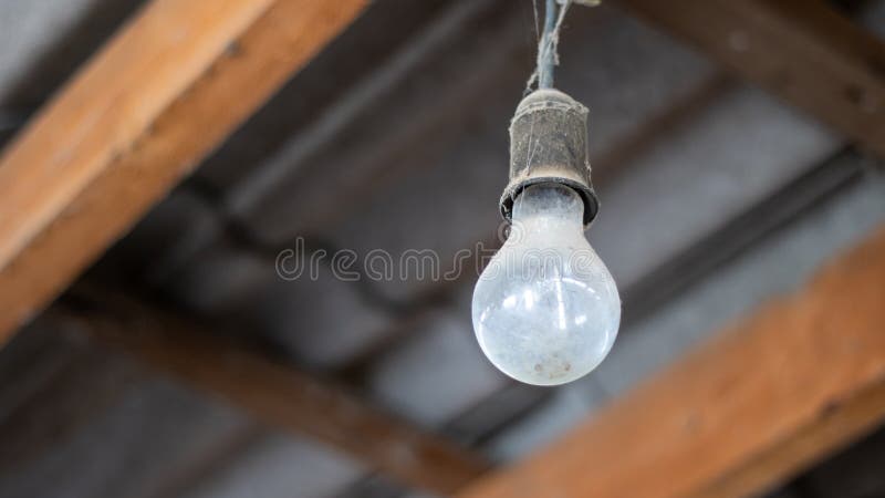 An Old Vintage Soviet Light Bulb in the Garage. Light Bulb in the Dust ...