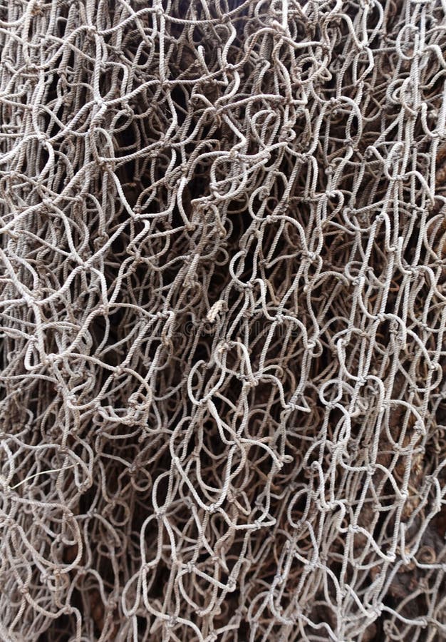 Old Vintage Texture of a Fishing Net Woven from a Thin Rope. Stock ...