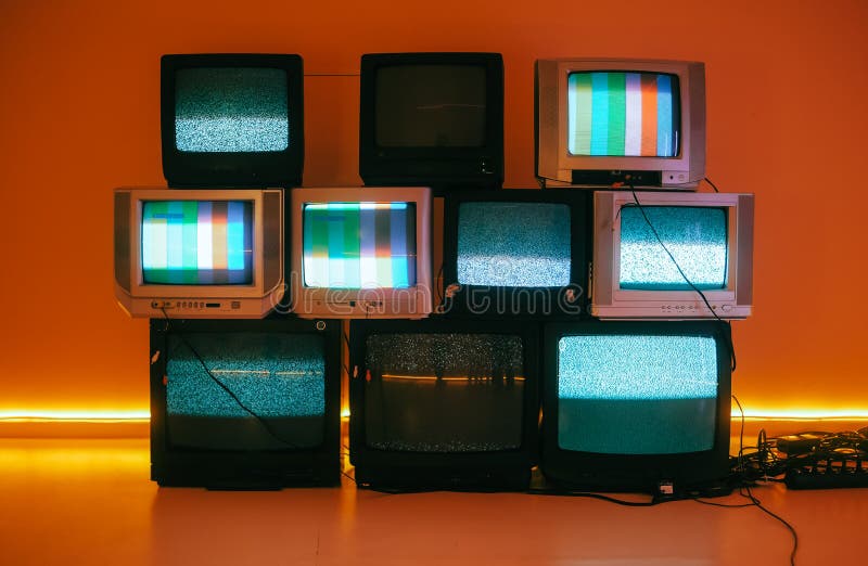 Old Vintage Tvs on a Floor in a Room with Colored Neon Light Stock ...