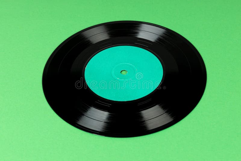 Old Vinyl Disc on Green Background. Old Vintage Vinyl Record Stock ...