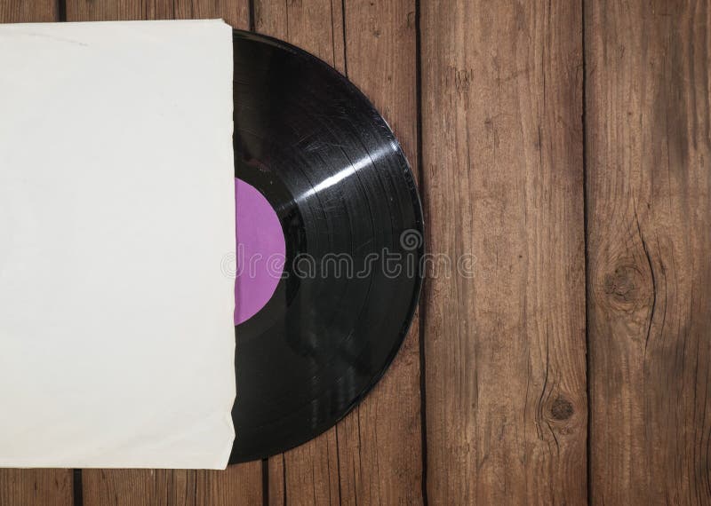 Old Vinyl Record in Paper Case on Wooden Rustic Background Stock Image ...