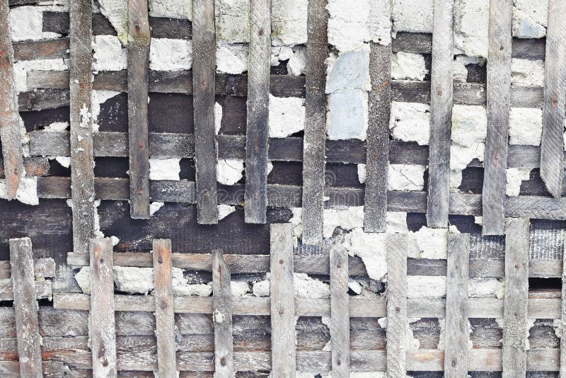 Destroyed Wall Reinforced with Wooden Lattice Stock Photo - Image of ...
