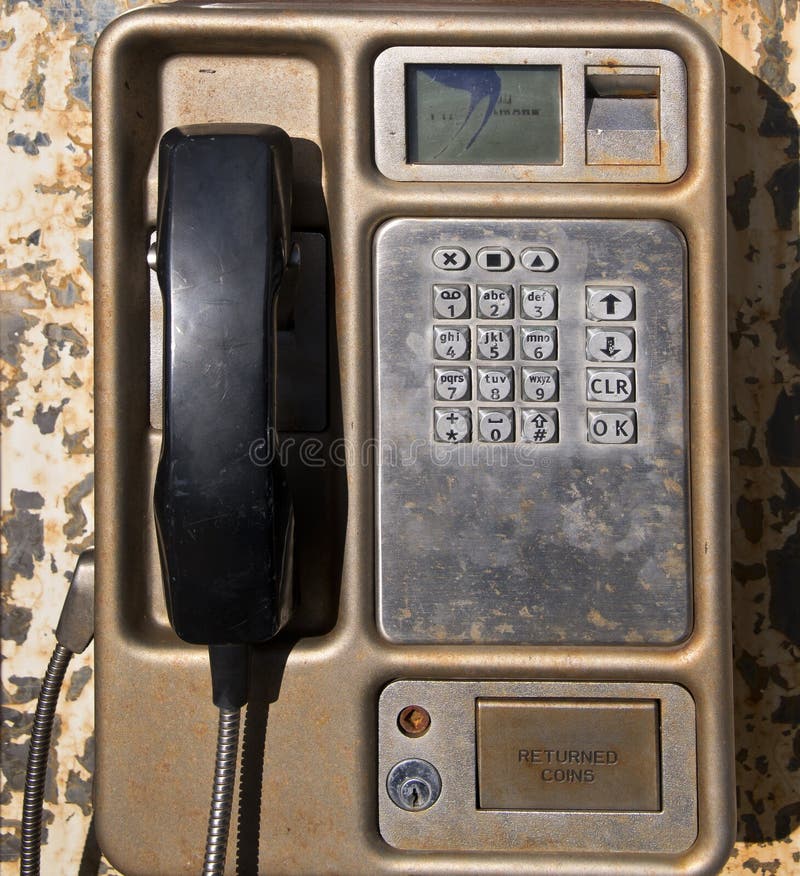 An Old Wall Mounted Outdoor Pay Phone. Stock Photo - Image of numbers ...