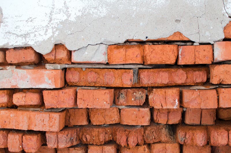 Old Wall with Peeling Plaster Which Protrude from Under the Bricks ...
