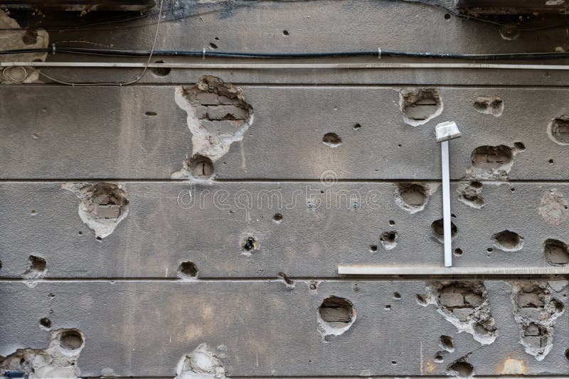 An Old Wall, Riddled with Time and Bullets, Creates a Dramatic Texture ...