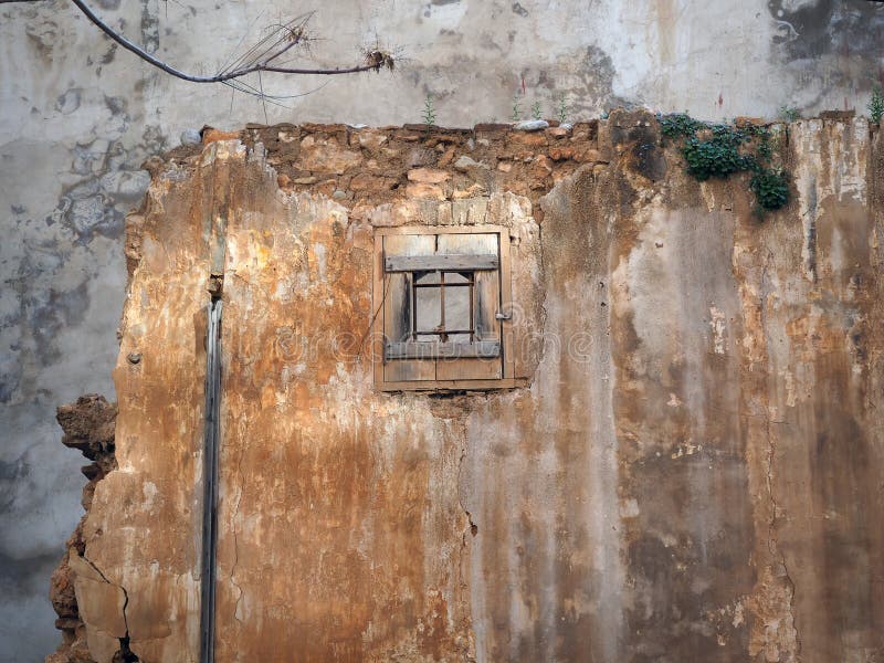 Old Wall with a Small Window Stock Photo - Image of street, yellow ...