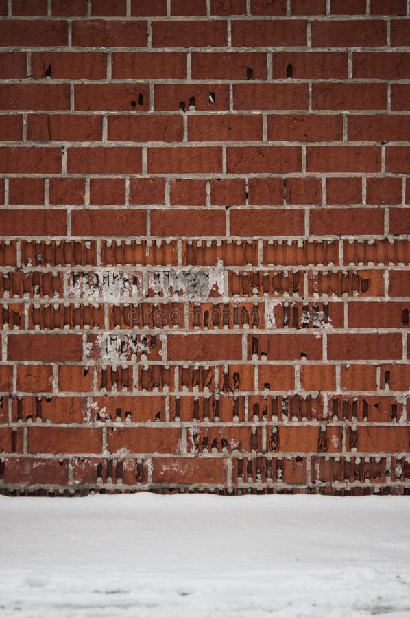 A Old Wall of Stone Bricks and a Ground Covered with Snow Stock Photo ...