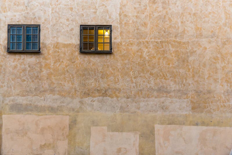 Old Wall with Two Small Windows. a Light is on in the Window Stock ...