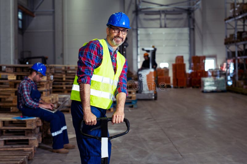 Warehouse Workers Pulling a Pallet Truck. Stock Image - Image of store ...