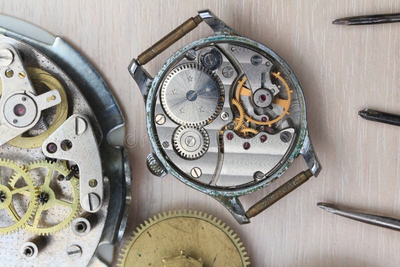 Old Watch Lying Disassembled on the Table with Repair Tools Stock Image ...