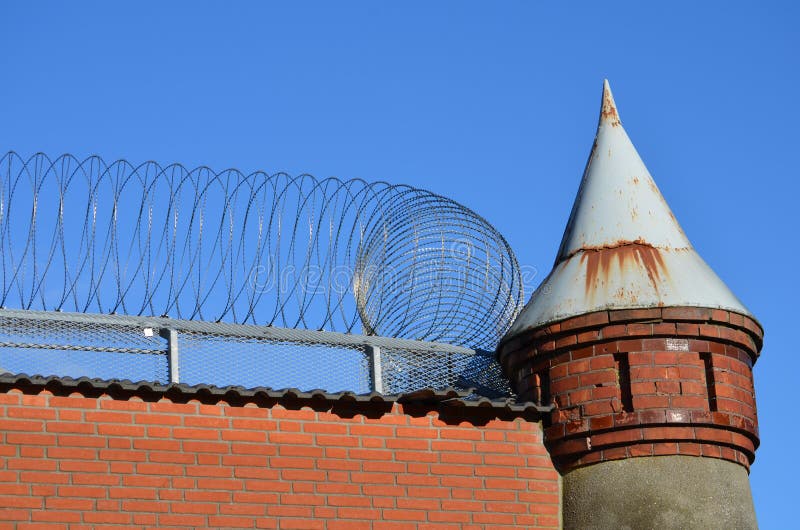 Old Watchtower with Barbwire on a Prison Wall Stock Photo - Image of ...