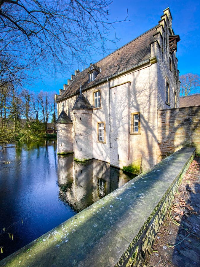 Old Water Castle with Trees and Reflections in Water Stock Photo ...