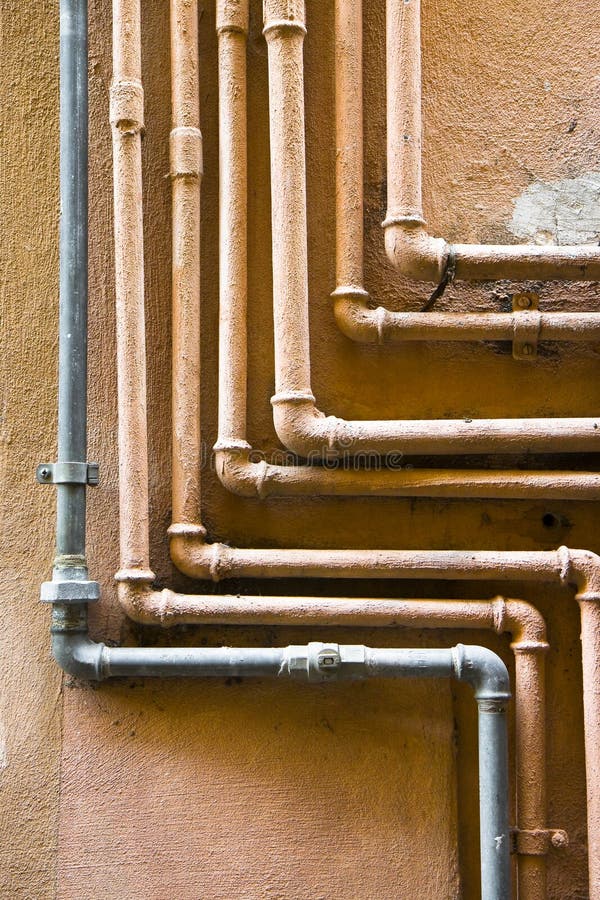 Old Water and Gas Pipes Varnished in Yellow and Fixed with Metal ...