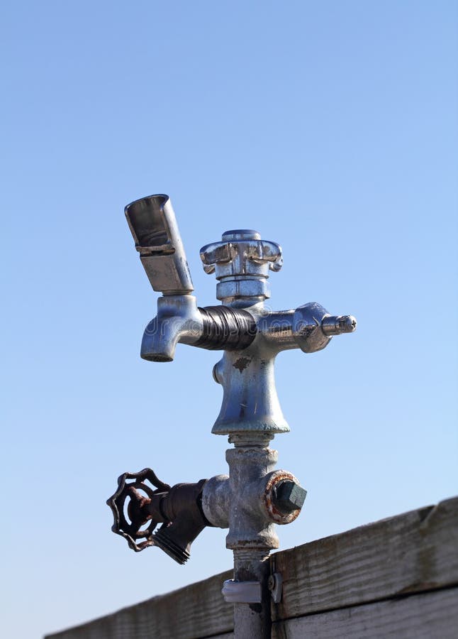 Old Water Spigot on Pier stock photo. Image of caught - 23979294