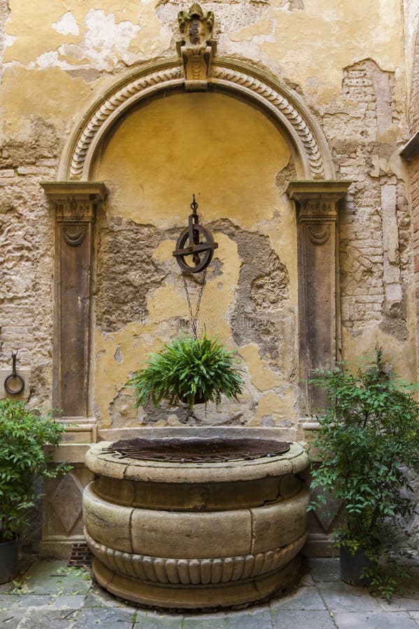 Old Water Well In The Square. Italy Stock Photo - Image of corroded ...