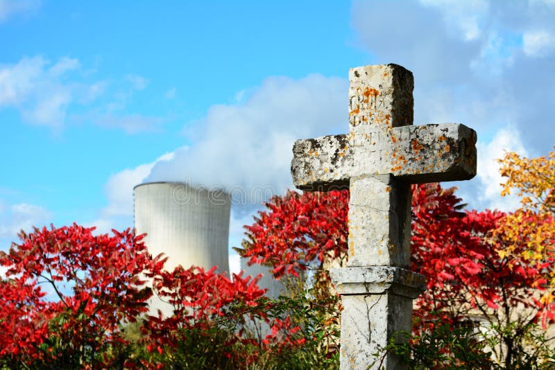 Old and Weathered Christian Stone Cross with a Nuclear Power Plant in ...