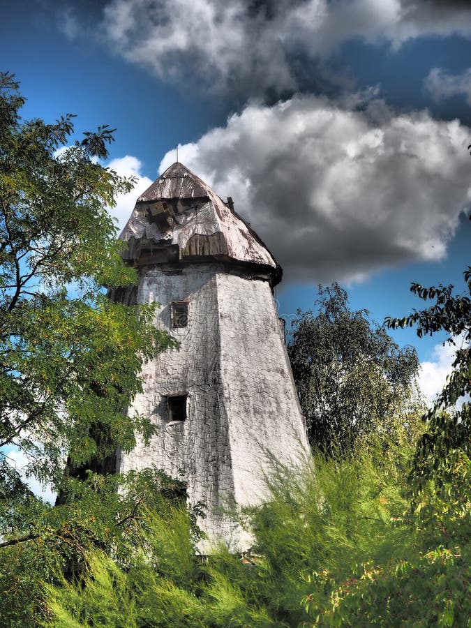 Old Weathered and Defunct Wind Mill in Dramatic Weather Stock Image ...